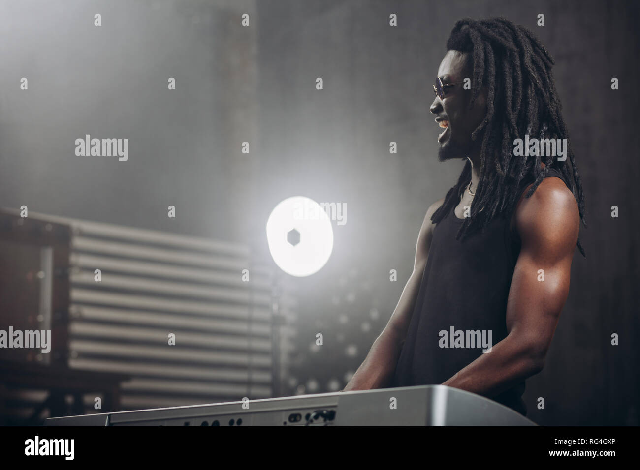 cheerful afro musician recording the music in the studio Stock Photo - Alamy