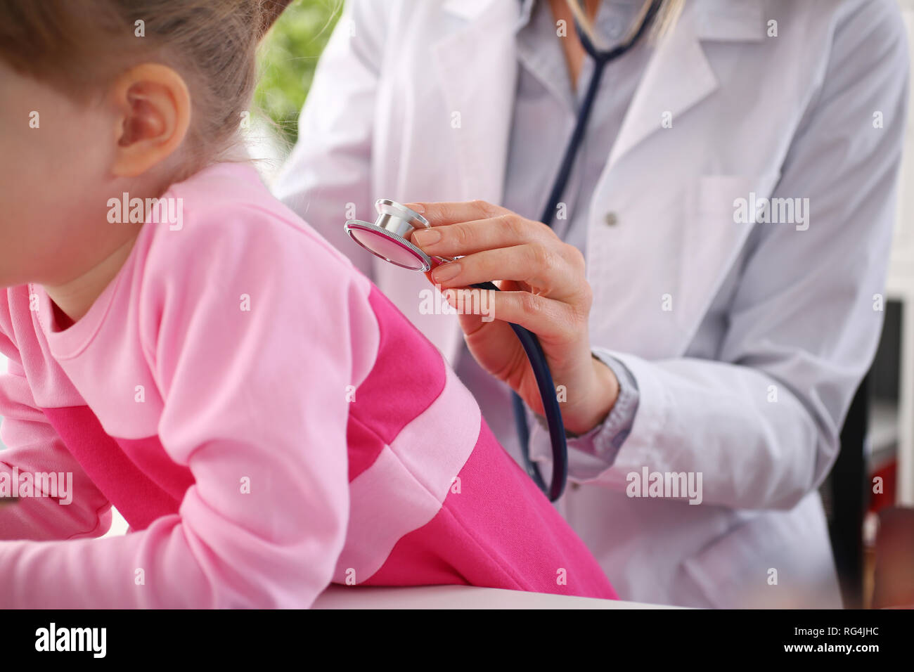 Little child with stethoscope at doctor reception Stock Photo - Alamy