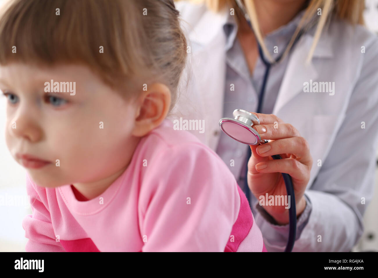 Little child with stethoscope at doctor reception Stock Photo - Alamy