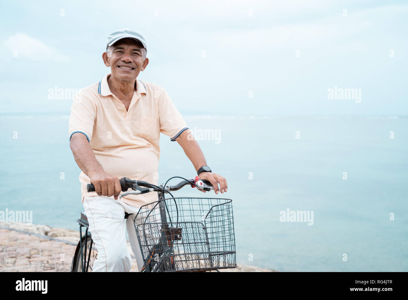 senior male riding a bicycle Stock Photo - Alamy