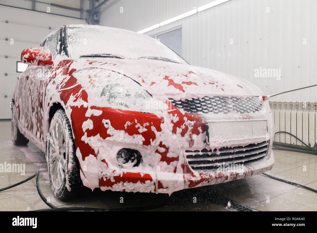 Russia Kemerovo 2019-01-05 Suzuki Swift bright red small car at car ...