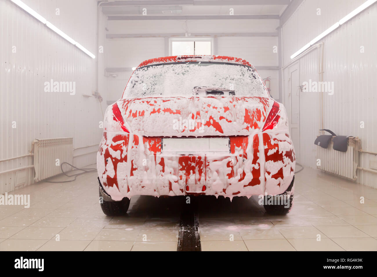 Russia Kemerovo 2019-01-05 Suzuki Swift bright red small car at car ...