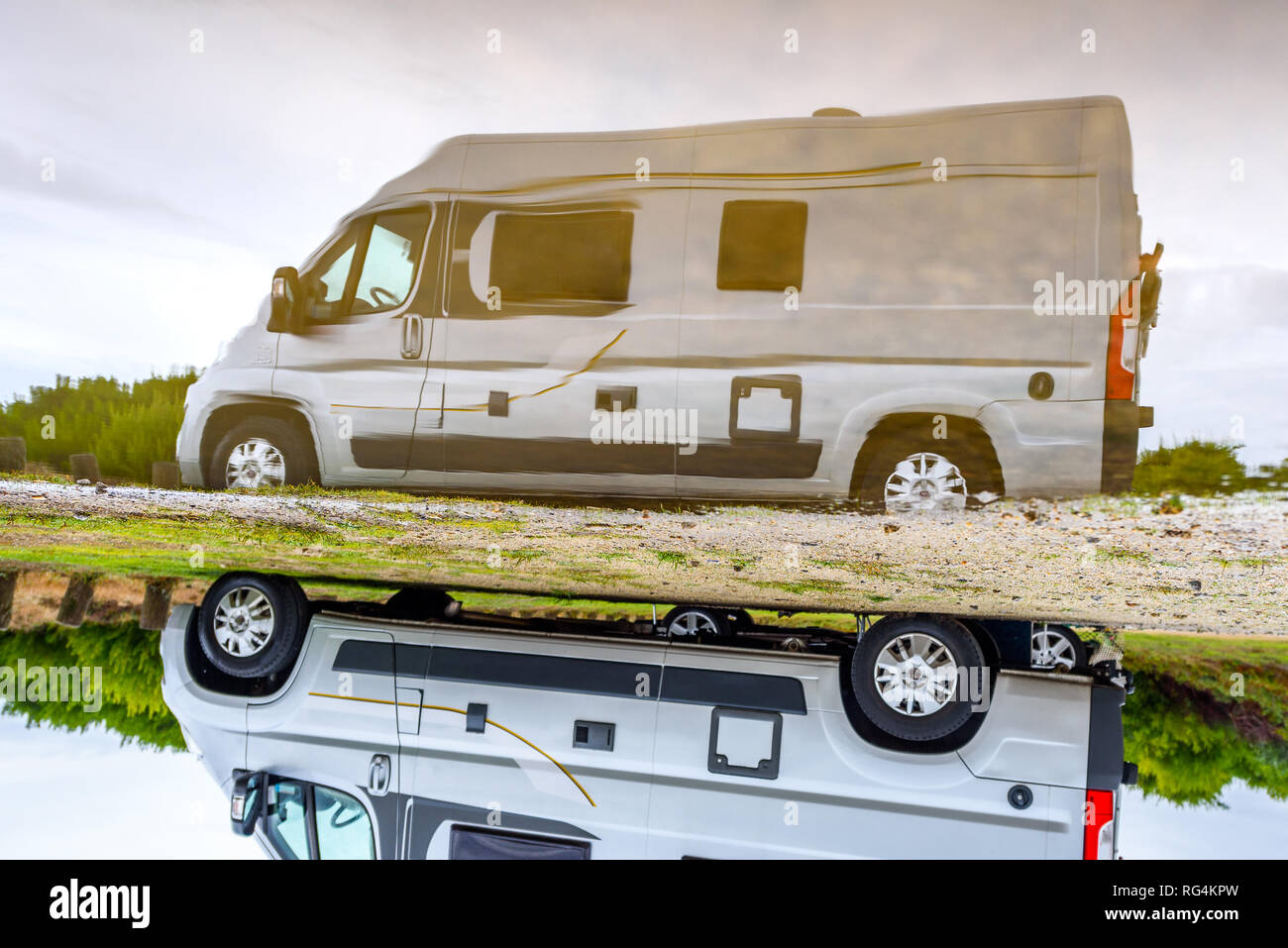 Campervan or motorhome camping on rainy day with rain puddles. Family ...