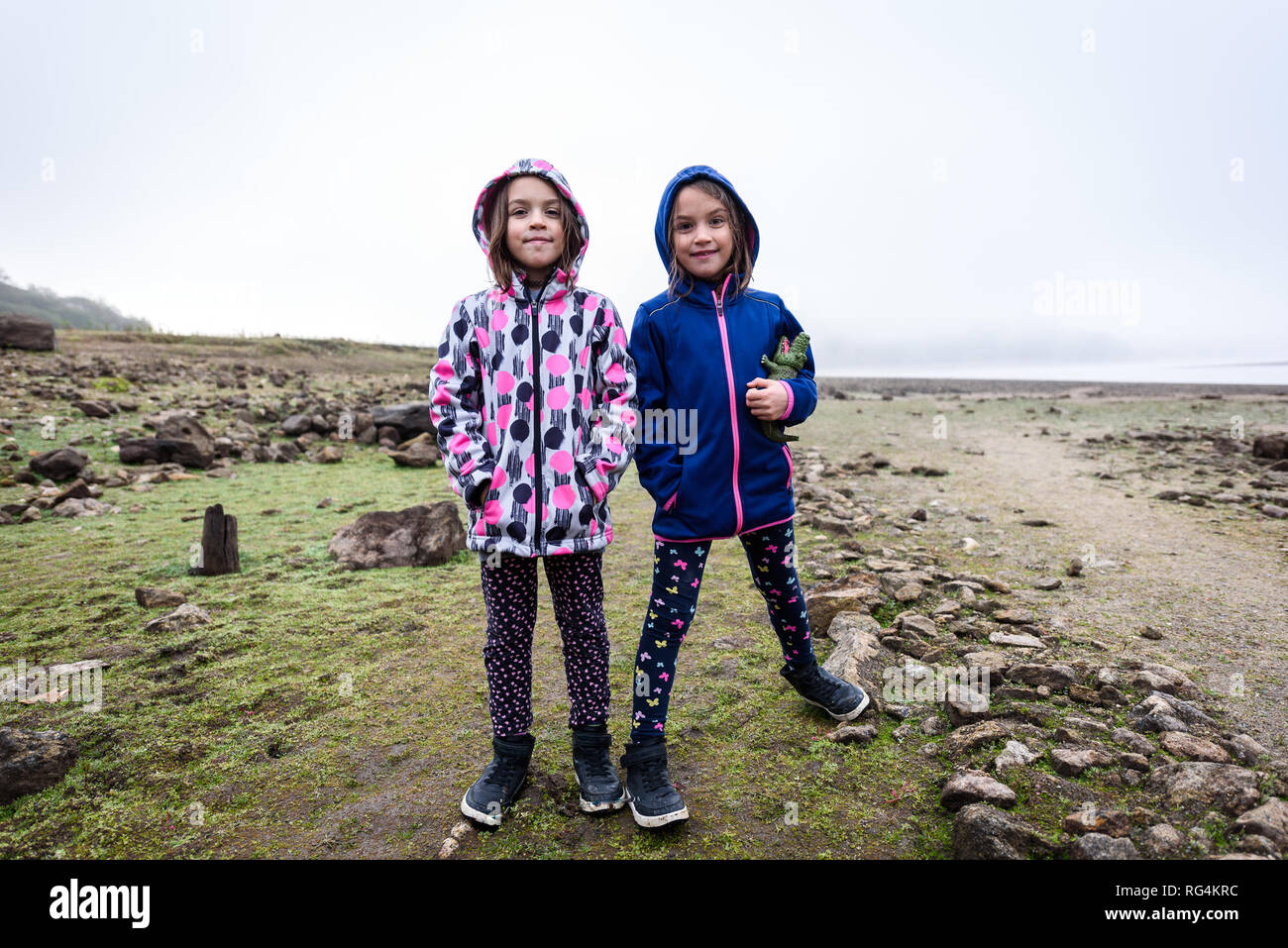 Twin girls standing on remains of ancient roman ruins stone. Children ...