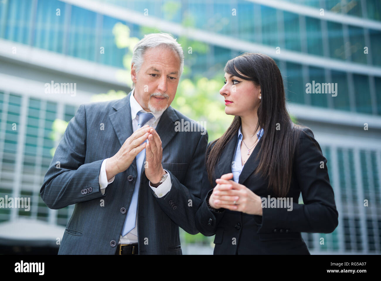 Business people talking outdoor Stock Photo - Alamy
