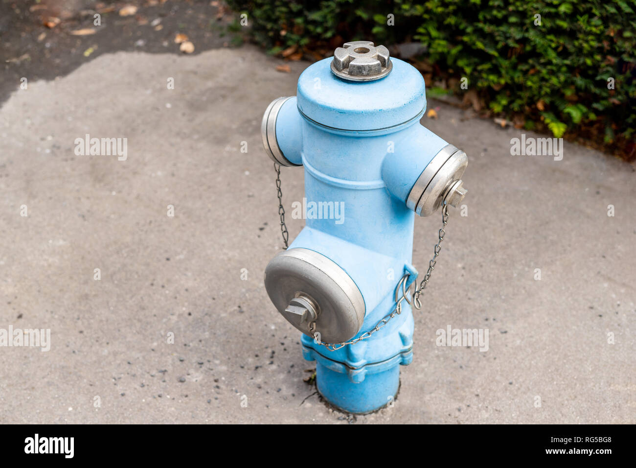 Blue metal vintage fire hydrant on asphalt road at city street Stock ...