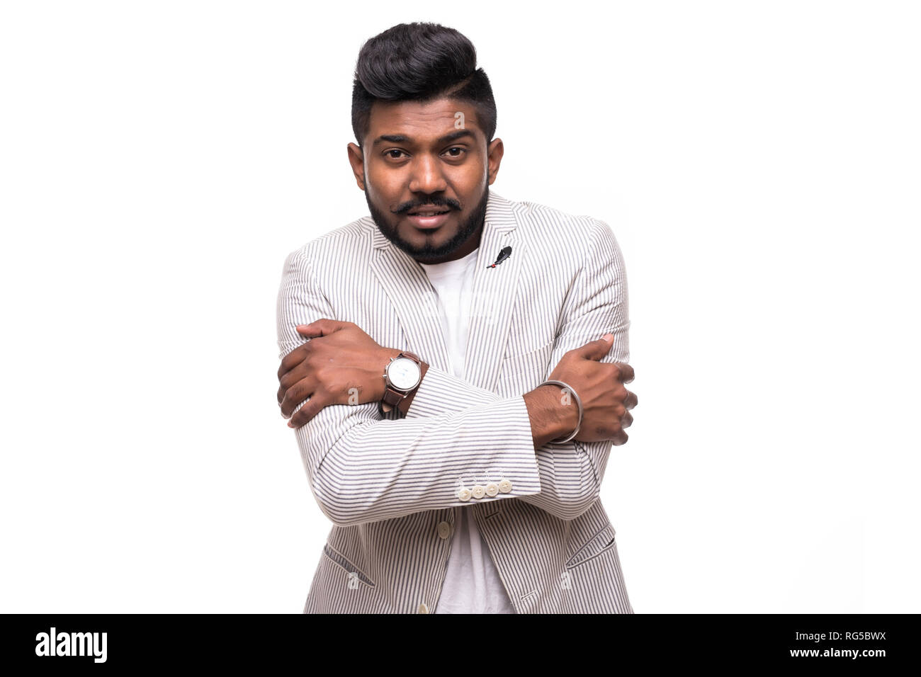 Young indianman wearing freezing isolated on white background Stock ...