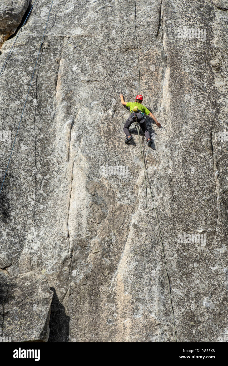 Climbing on tall granite cliffs in Yosemite National Park in California ...