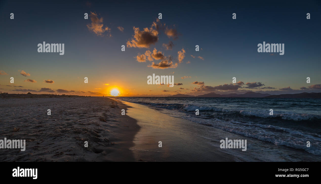 Sunset on sandy Alikes beach near Tigaki with dramatic cloudy sky ...