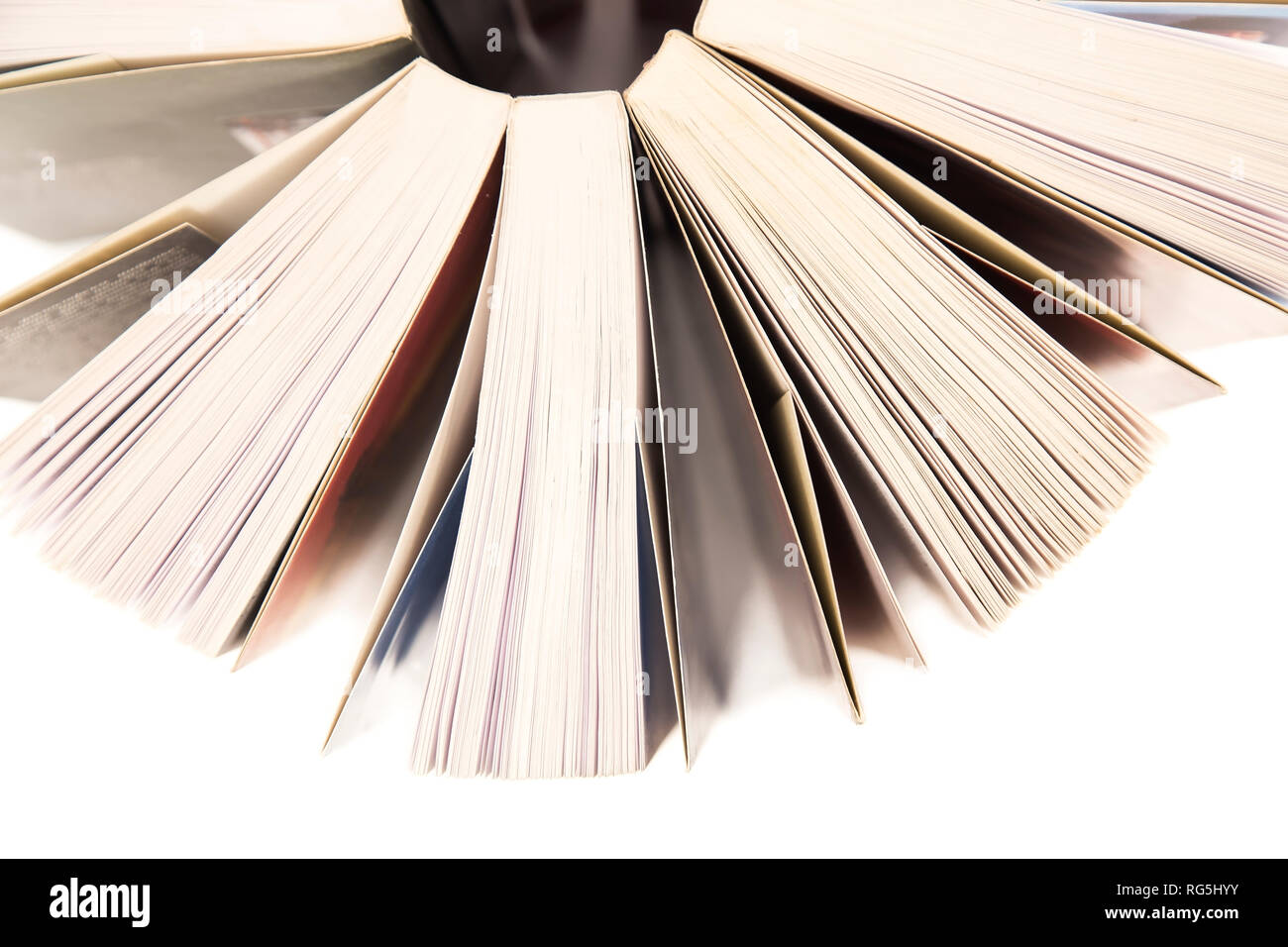 Open books close up on white background Stock Photo - Alamy