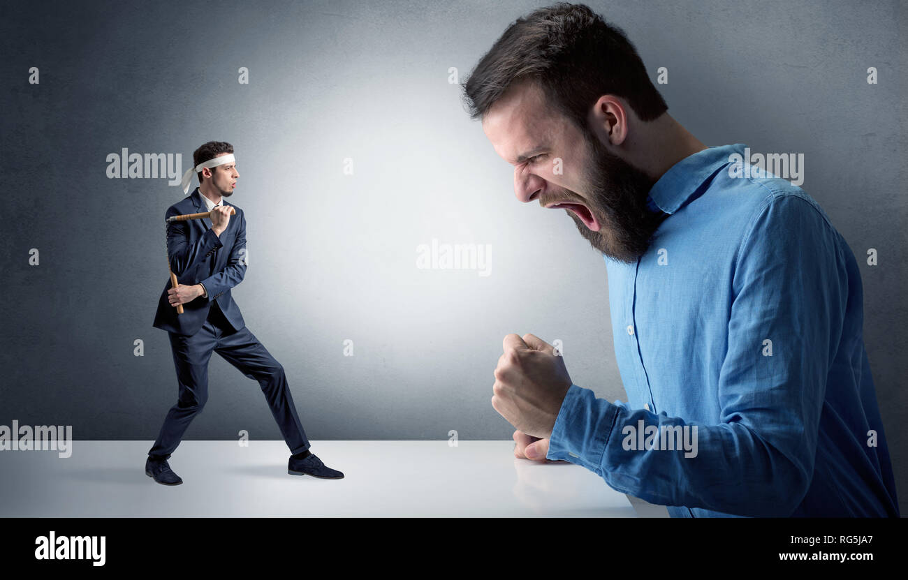 Giant hipster man yelling at a small karate man Stock Photo - Alamy