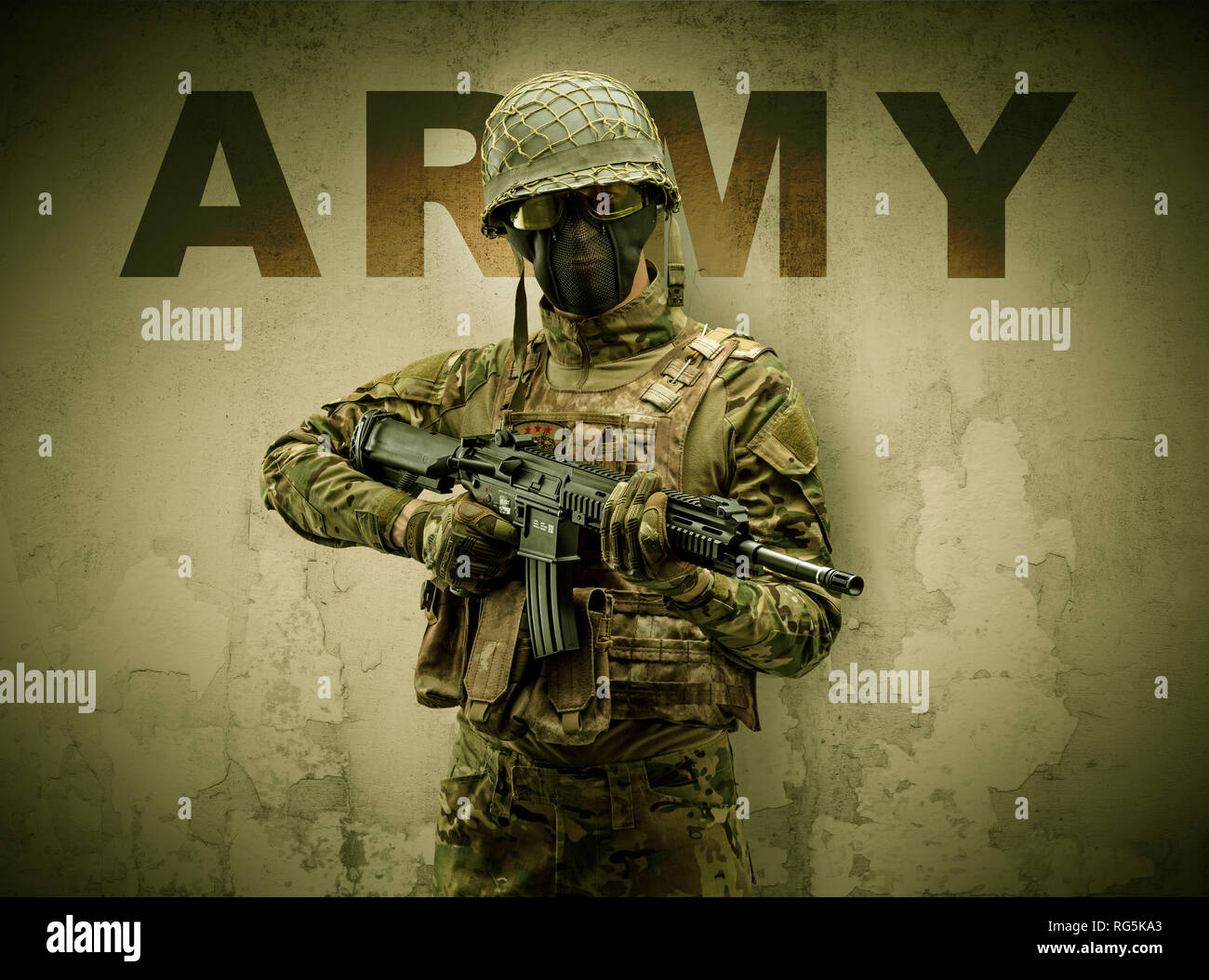 Uniformed armed soldier with damaged wall background Stock Photo - Alamy