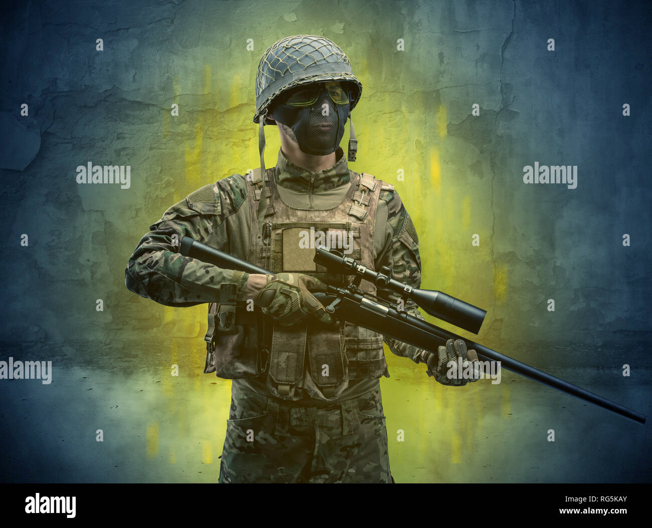 Hazard, menace soldier in a ruined crumbly building with arms on his ...