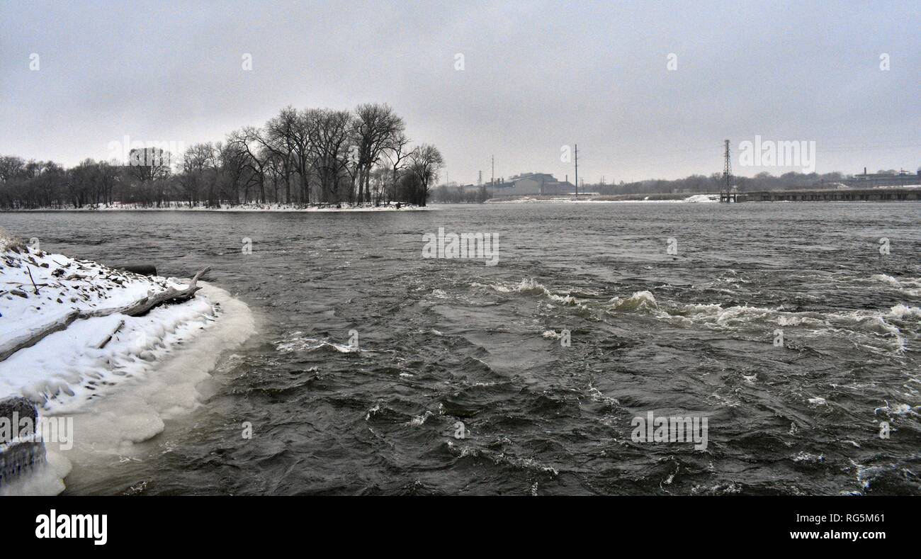 icy river flowing near the shore Stock Photo - Alamy