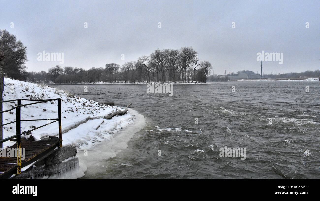 icy river flowing near the shore Stock Photo - Alamy