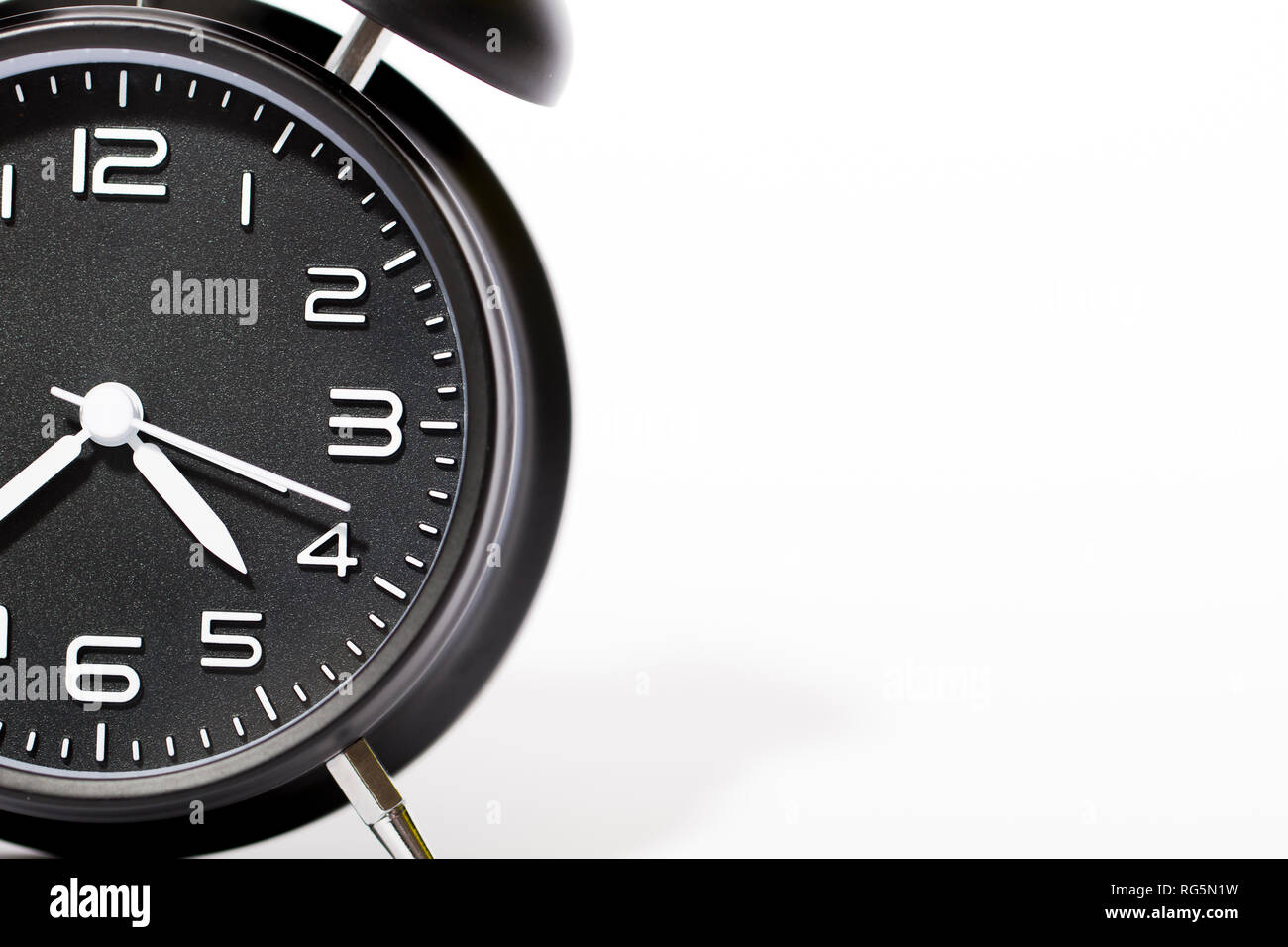 A black alarm clock Stock Photo - Alamy