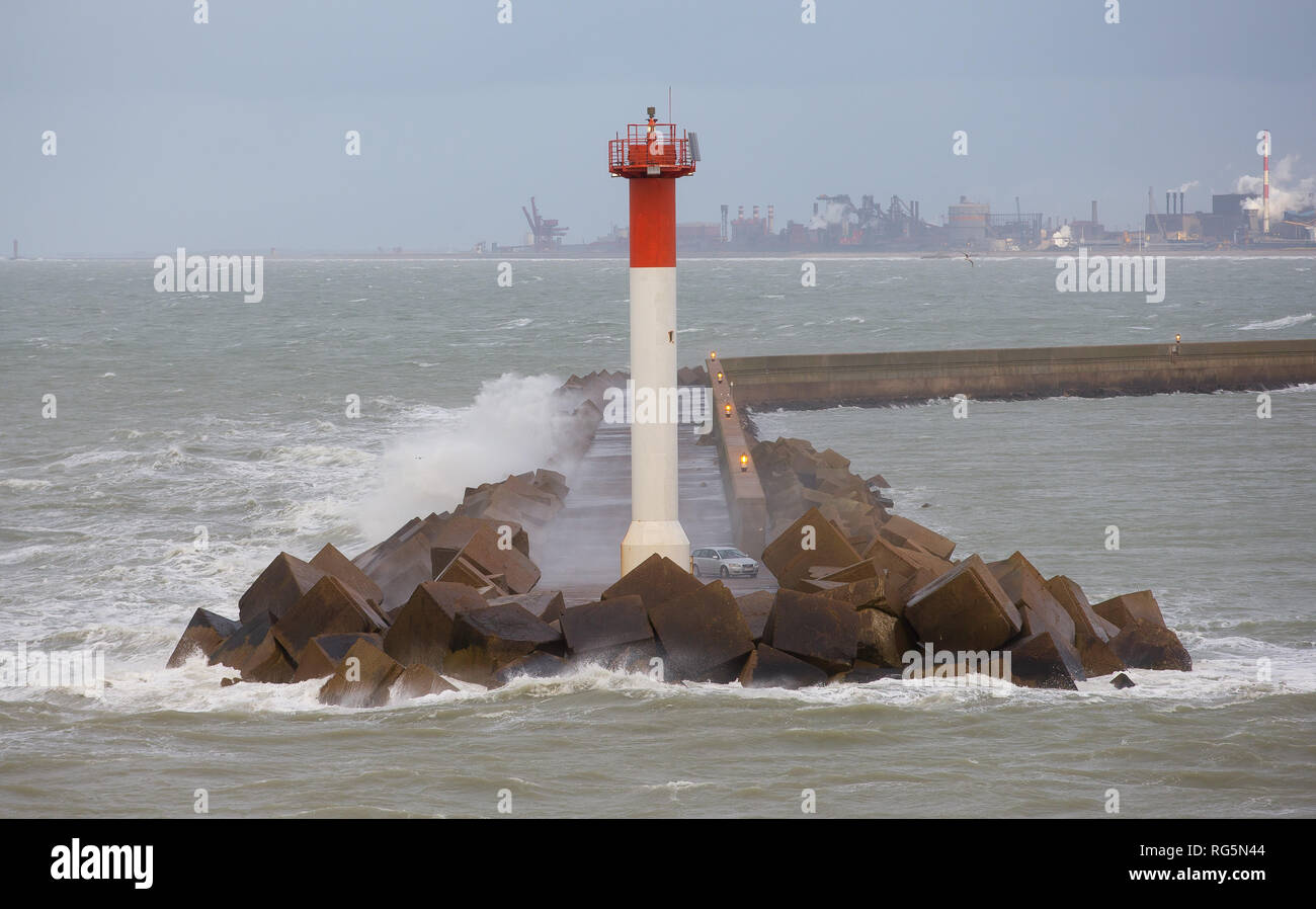 The red port channel marker and breakwater harbour wall at the entrance ...