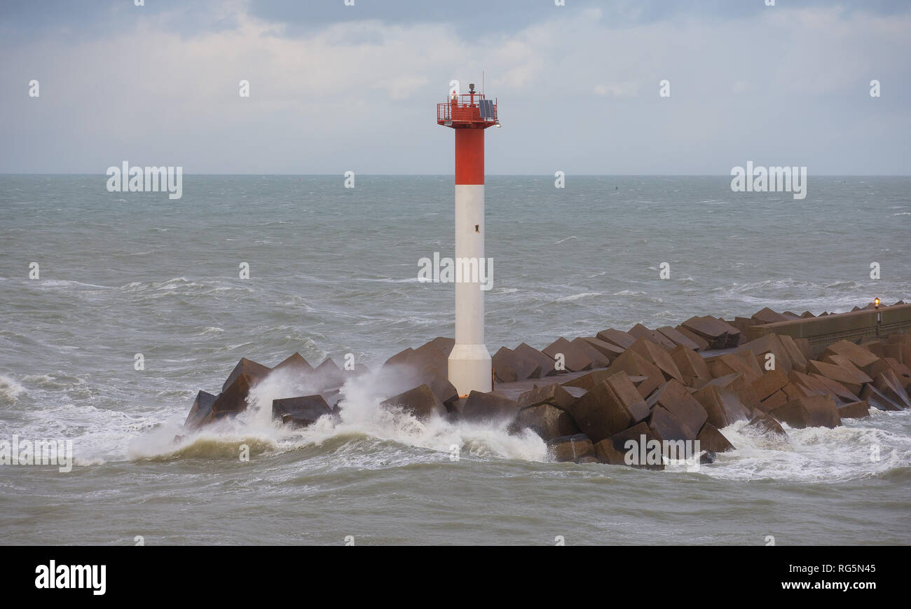 The red port channel marker and breakwater harbour wall at the entrance ...