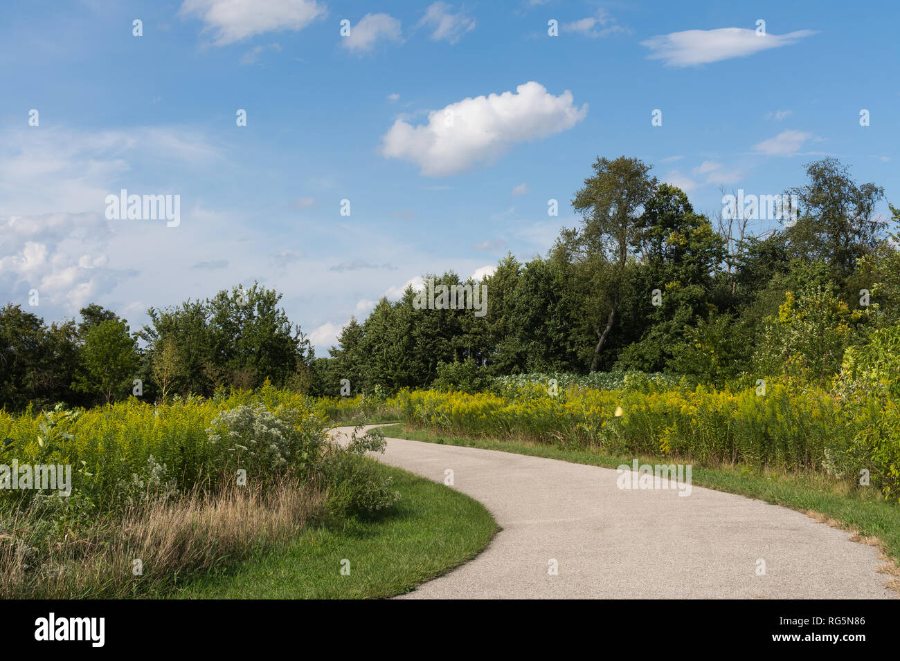 Curved concrete path through the prairie. Channahon State Park ...