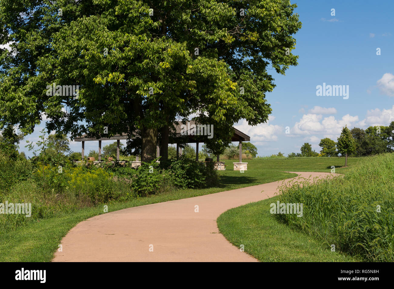 Curved concrete path through the prairie. Channahon State Park ...