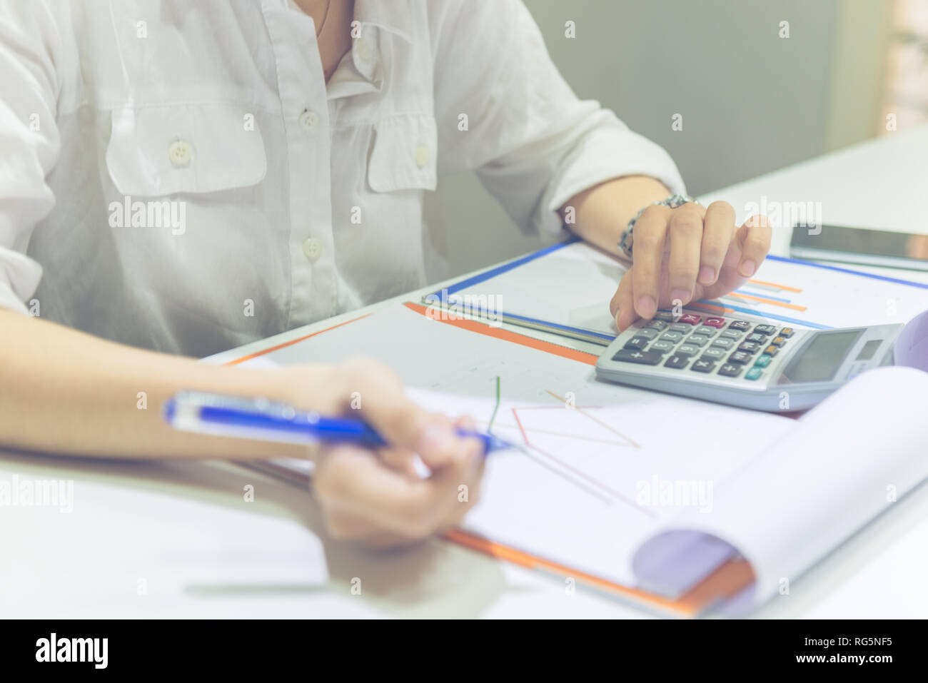 Close-up of woman hand calculate sales on the calculator Stock Photo ...