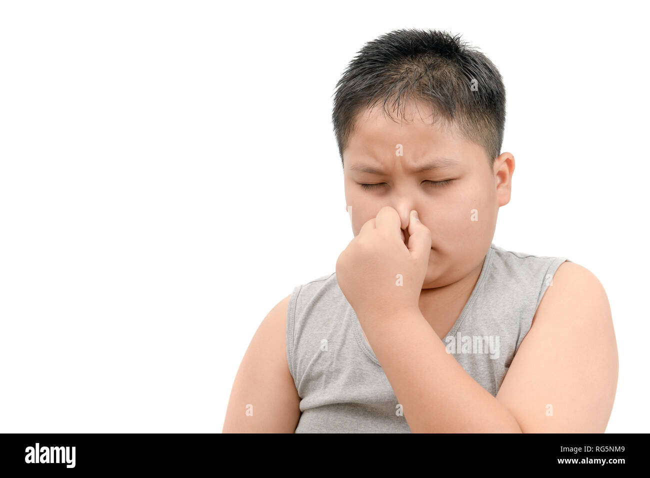 Fat boy covering his nose because of a bad foul smell against isolated ...