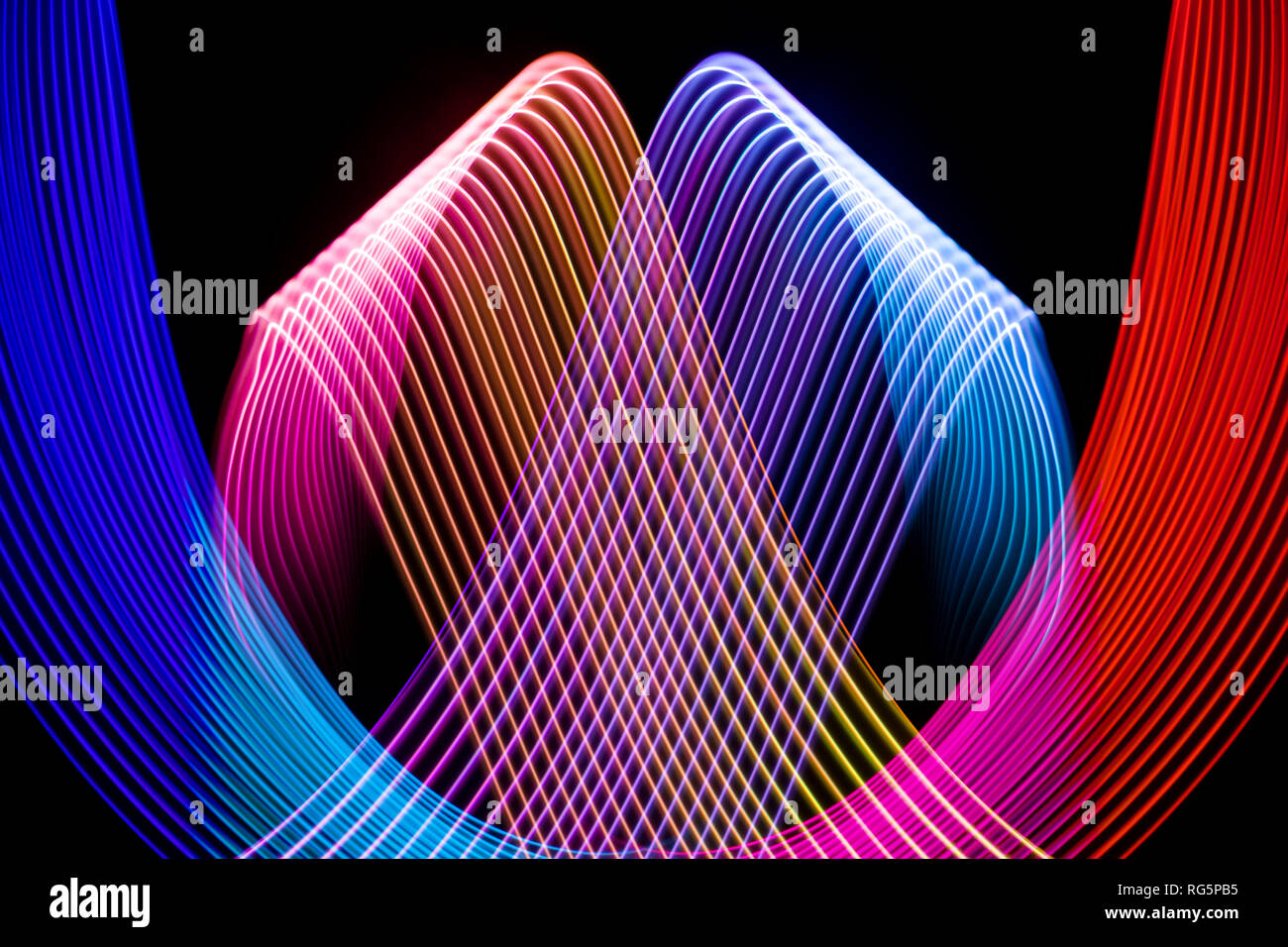 Abstract rainbow blue,pink and red neon glowing crossing lines pattern. Dark background of ...
