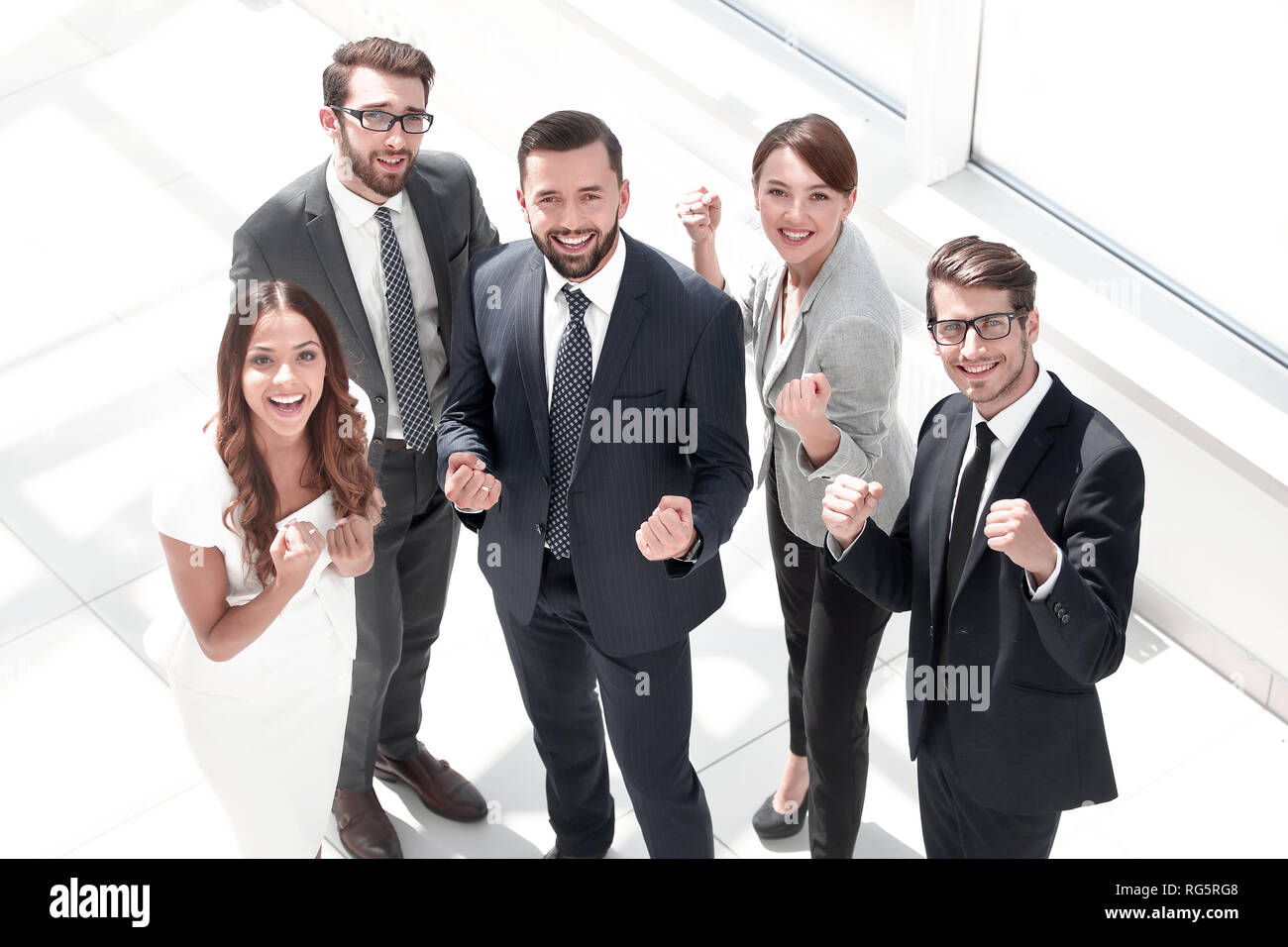 Happy successful business team stand hi-res stock photography and ...