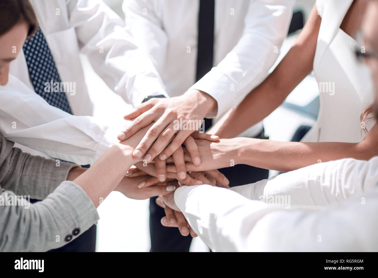 Close up .young business people putting their hands together Stock ...
