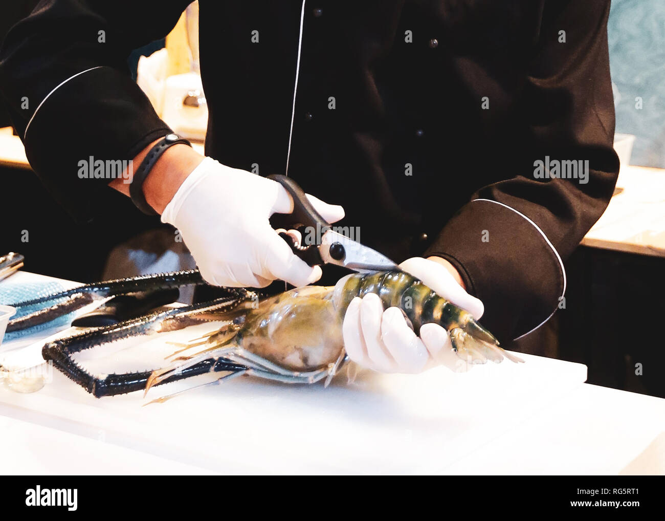 chef cooking seafood, Hand cutting raw black tiger prawn Stock Photo ...