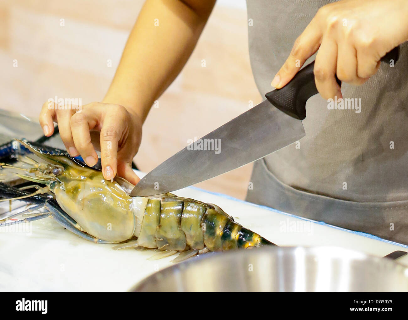 chef cooking seafood, Hand cutting raw black tiger prawn Stock Photo - Alamy