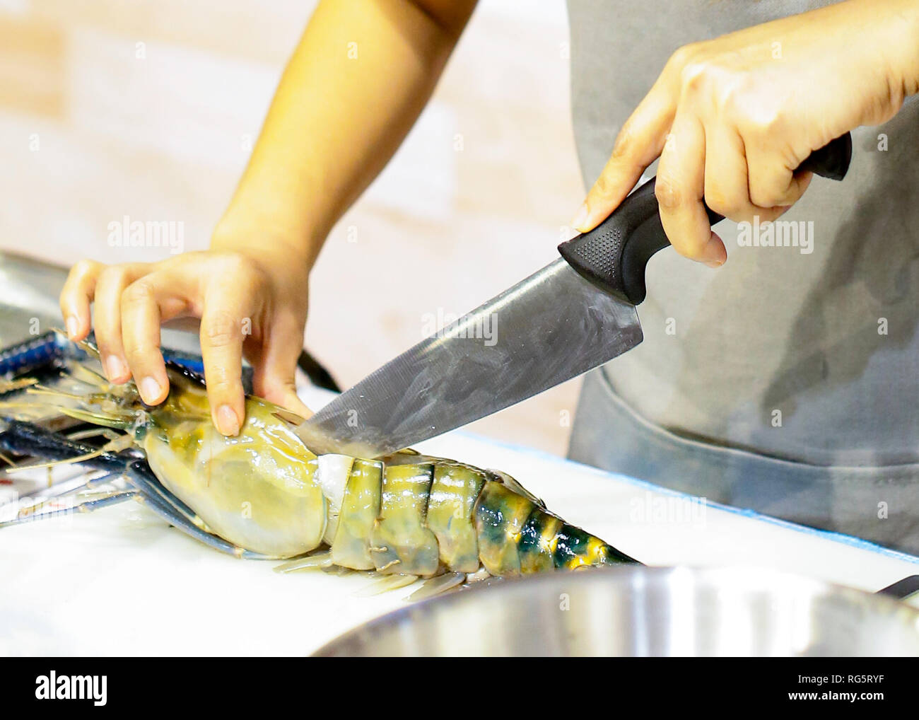 chef cooking seafood, Hand cutting raw black tiger prawn Stock Photo ...
