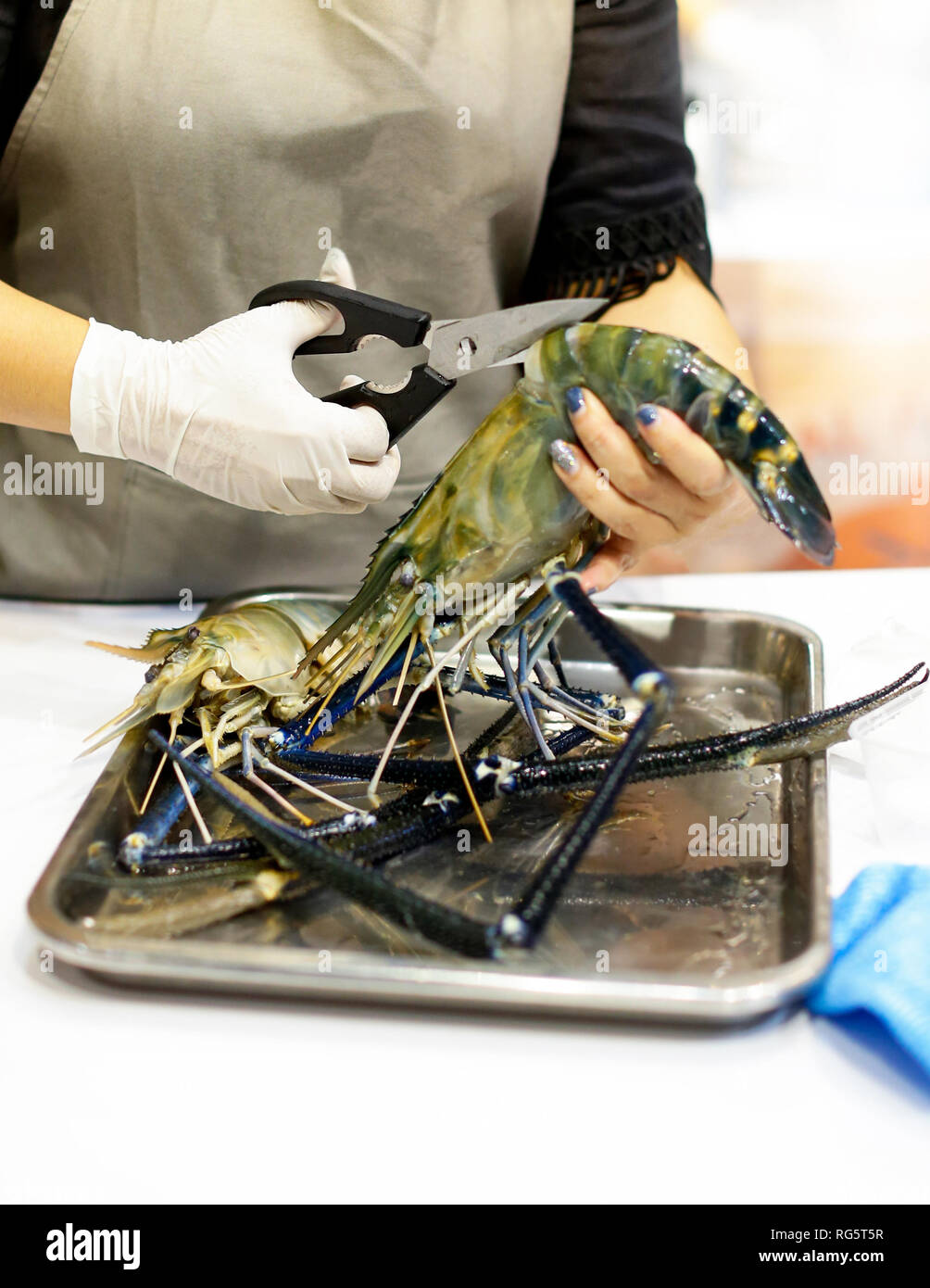 chef cooking seafood, Hand cutting raw black tiger prawn Stock Photo ...