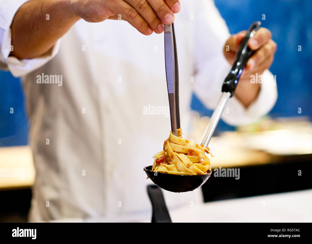 Chef cooking pasta, Chef serves spaghetti carbonara on the plate in the ...