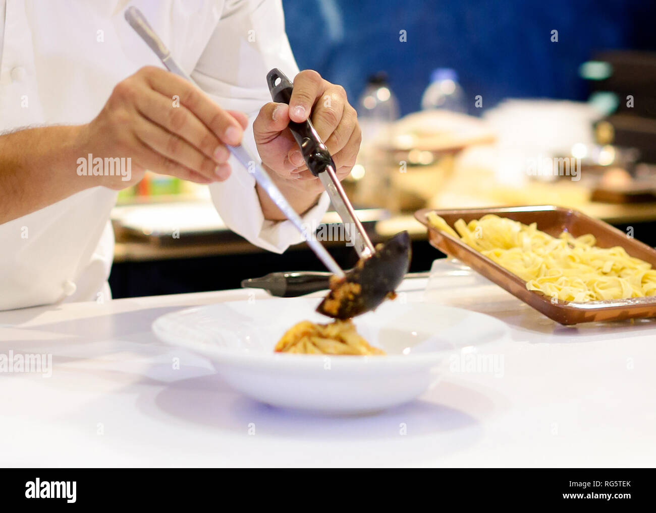 Chef cooking pasta, Chef serves spaghetti carbonara on the plate in the ...