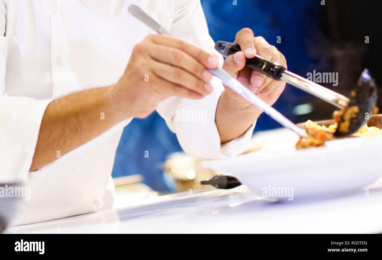 Chef cooking pasta, Chef serves spaghetti carbonara on the plate in the ...