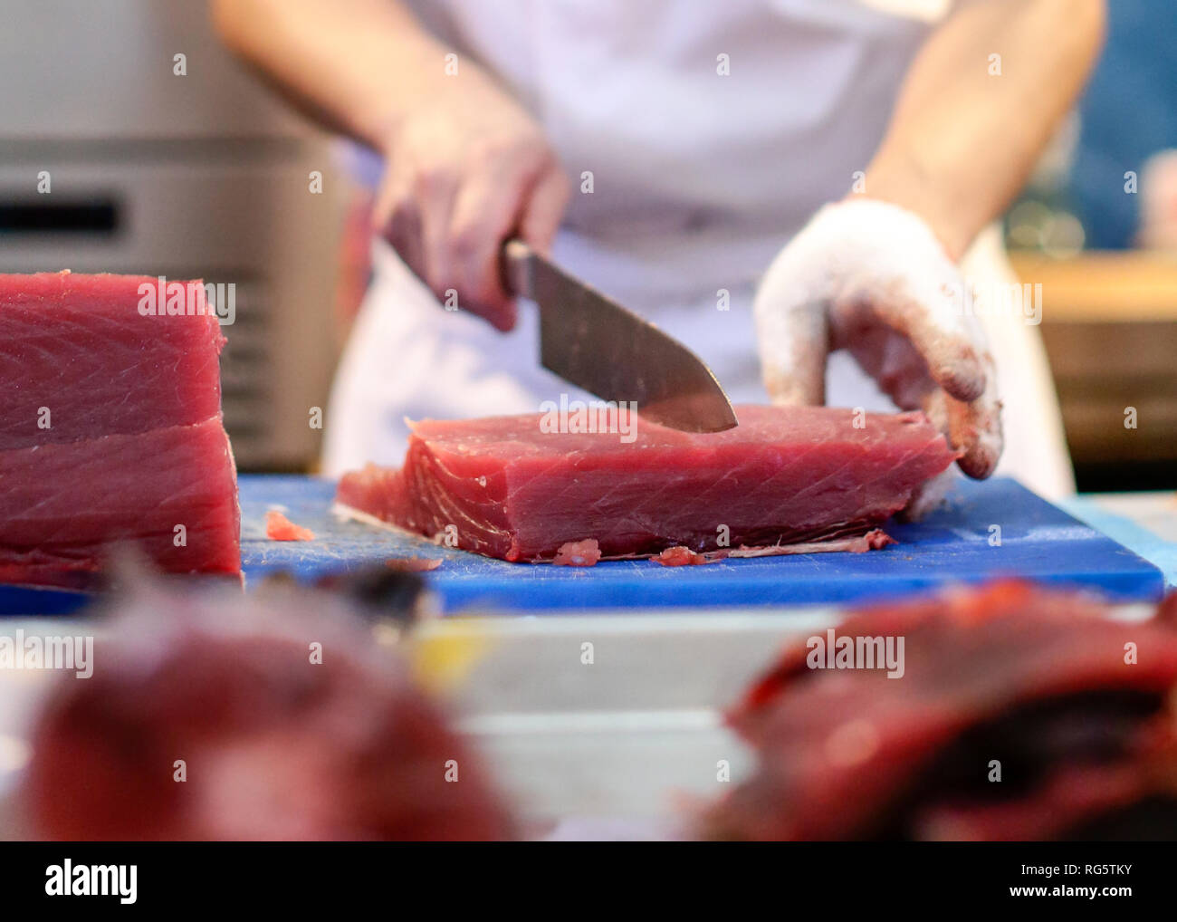 Chef cutting fresh tuna fish in the kitchen Stock Photo - Alamy