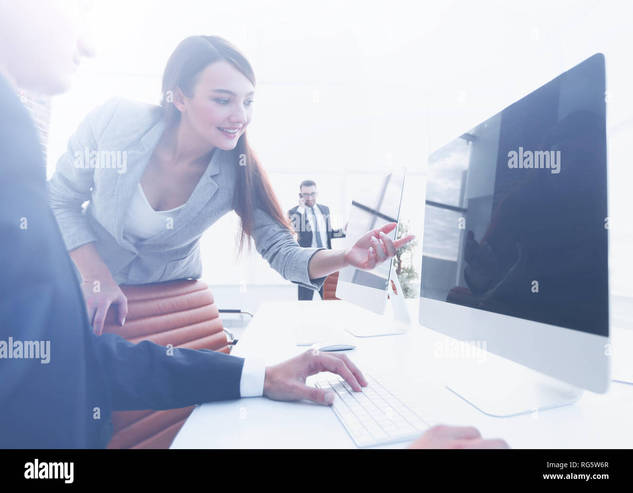 business woman pointing at the computer screen Stock Photo - Alamy