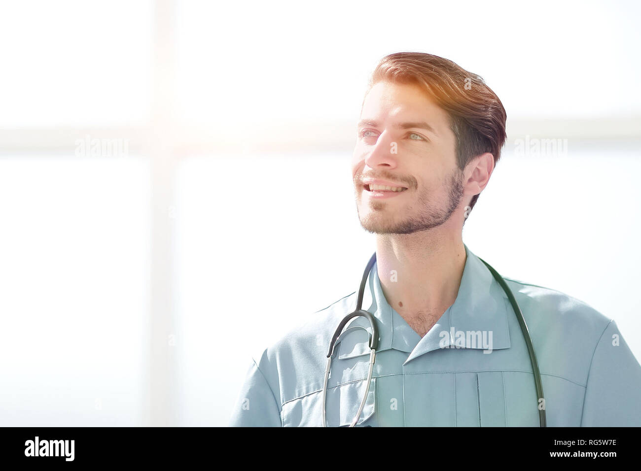 portrait of a friendly doctor in blue uniform Stock Photo - Alamy