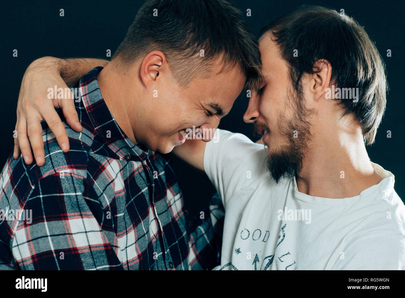 Guys hugging hi-res stock photography and images - Alamy