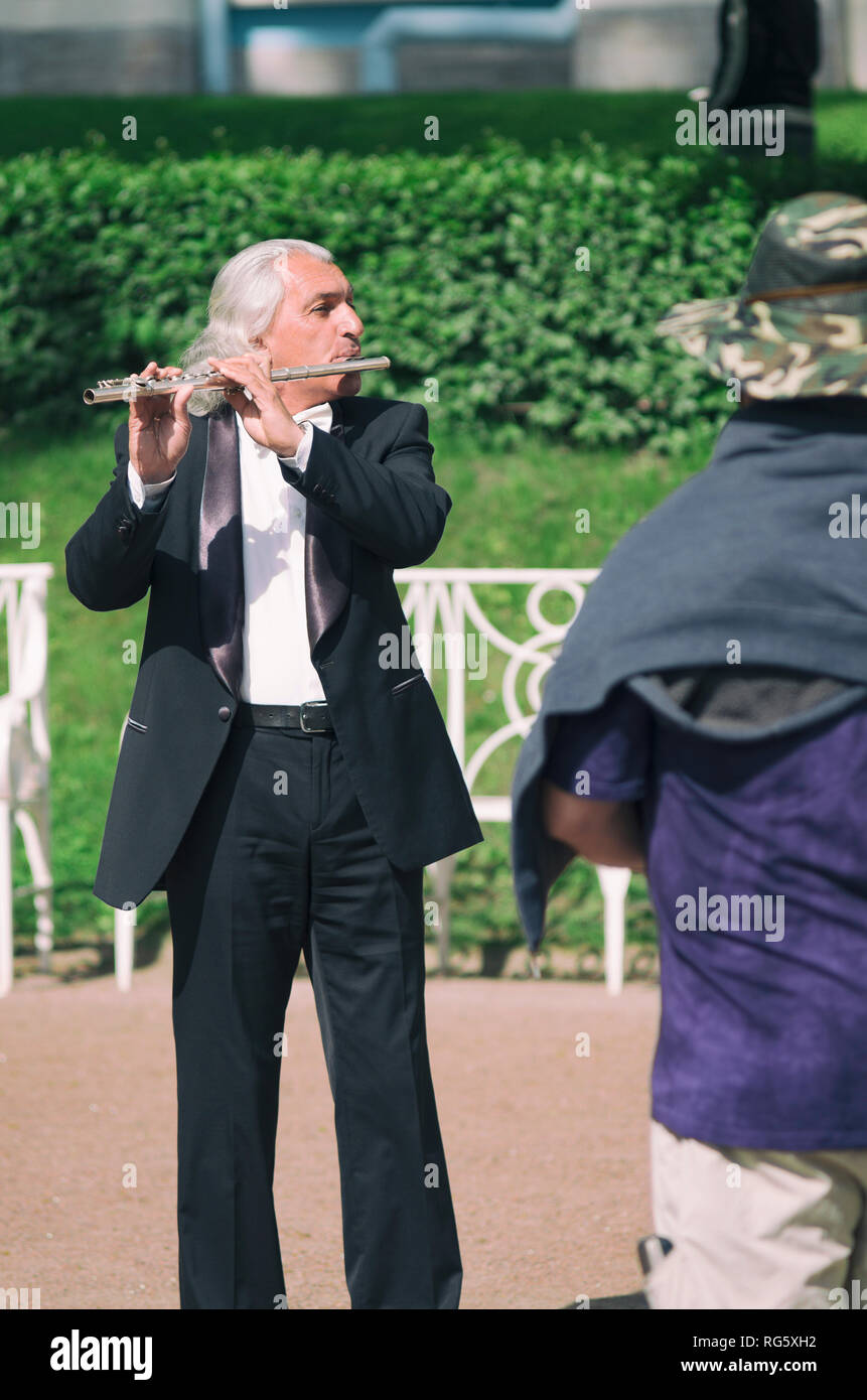 Man blowing flute hi-res stock photography and images - Alamy