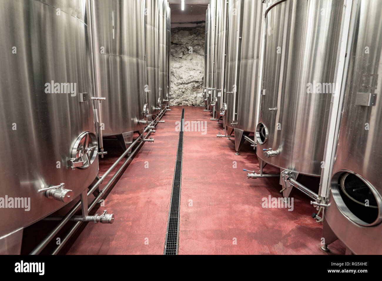 Aluminium tanks for making wine in a modern winery Stock Photo - Alamy