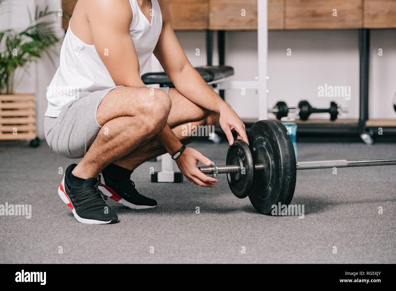 Muscular man putting heavy hi-res stock photography and images - Alamy
