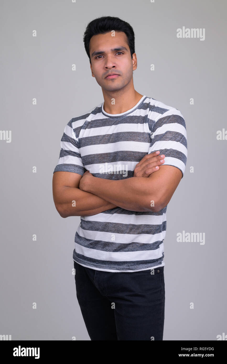 South indian man standing arms hi-res stock photography and images - Alamy