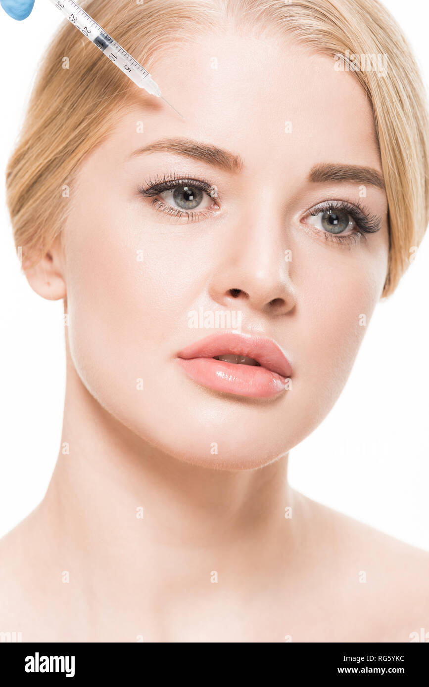 Woman receiving injection into forehead hi-res stock photography and ...