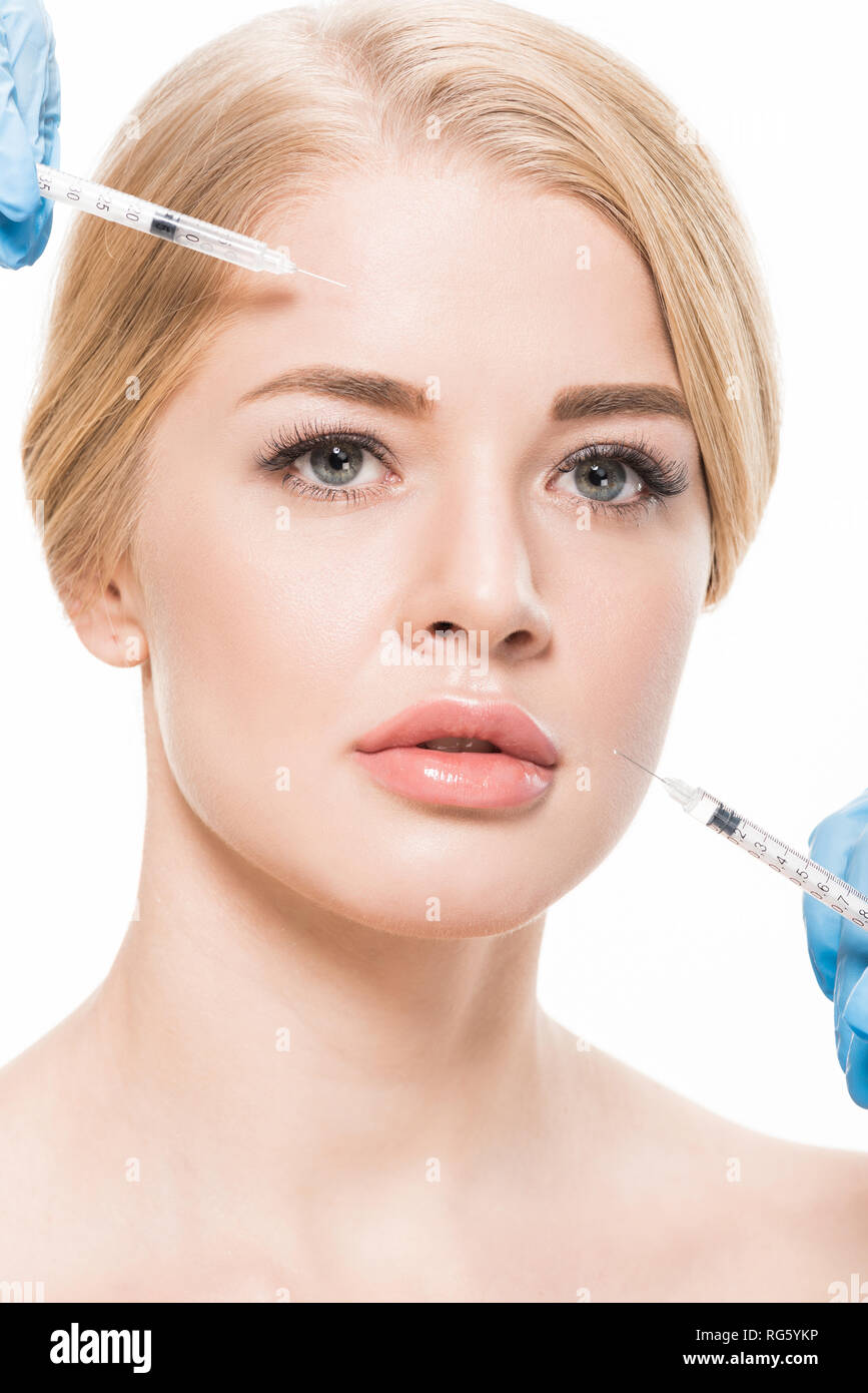 beautiful young woman receiving beauty injections in face isolated on ...