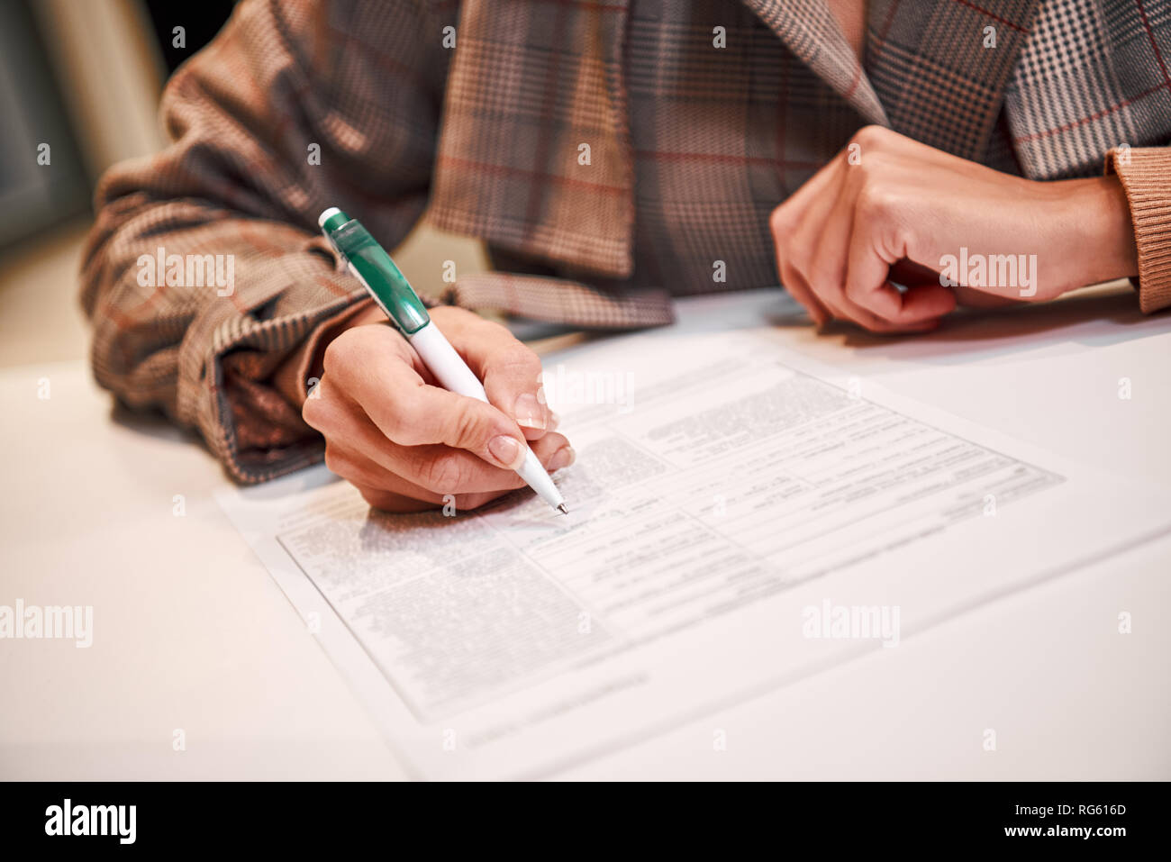 Time to sign deal contract. Businesswoman is fulfilling and signing ...