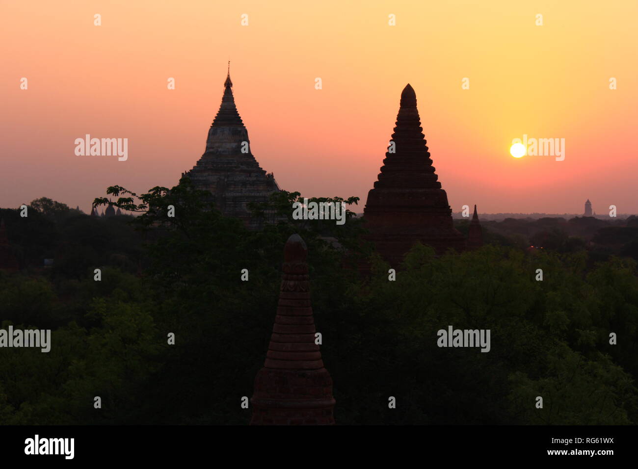 Rising sun in between of the temples in Bagan, Myanmar Stock Photo - Alamy
