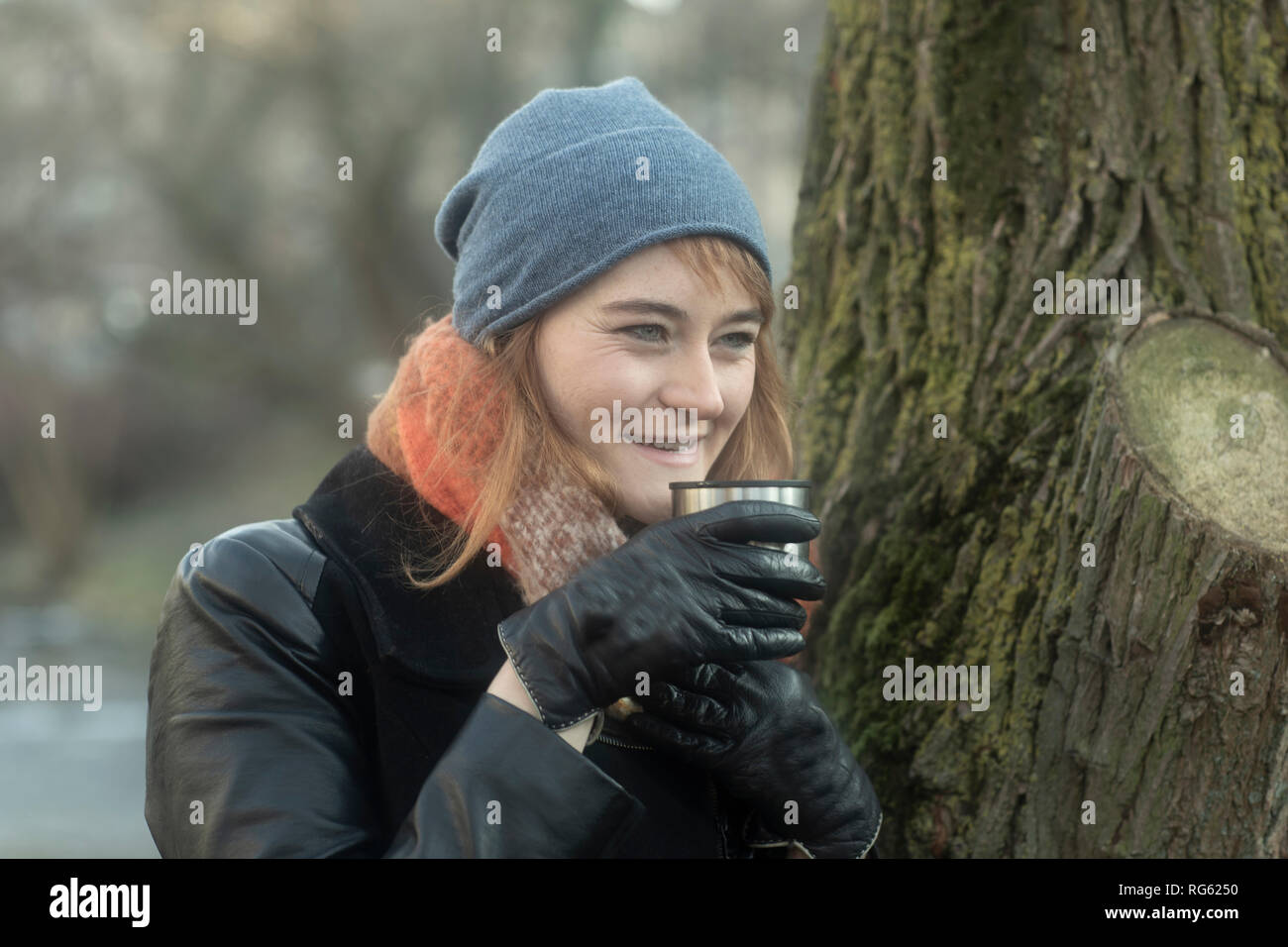 Woman standing outdoors hi-res stock photography and images - Alamy