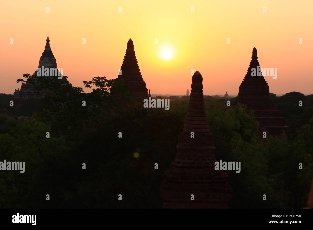 Rising sun in between of the temples in Bagan, Myanmar Stock Photo - Alamy